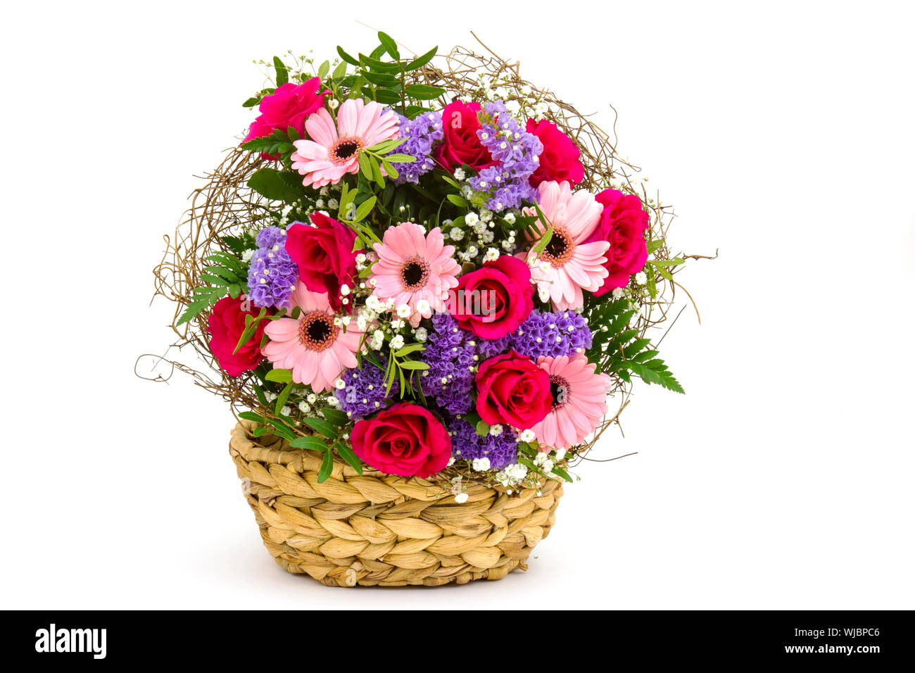 colourful flowers in a basket Stock Photo - Alamy