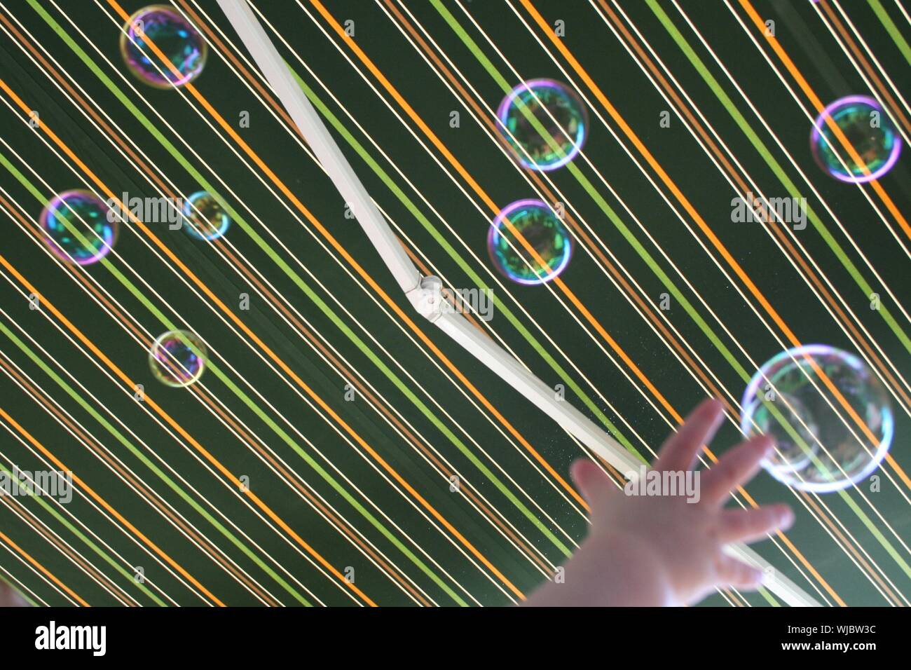 Hand and bubbles hi-res stock photography and images - Alamy