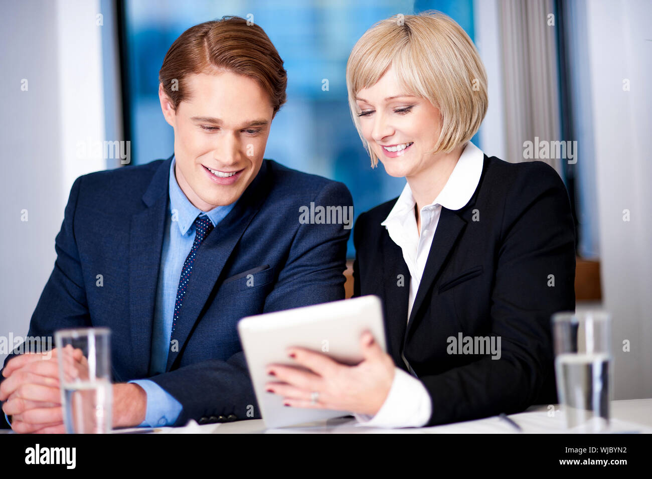 Secretary showing progress report to her boss Stock Photo - Alamy