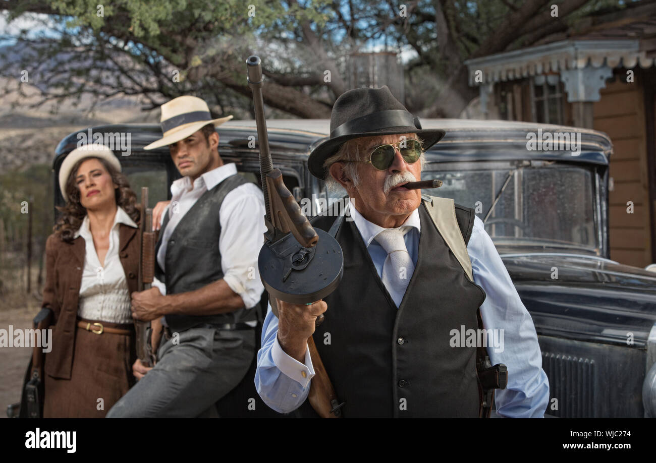 Tough 1920s gangster boss with partners Stock Photo - Alamy