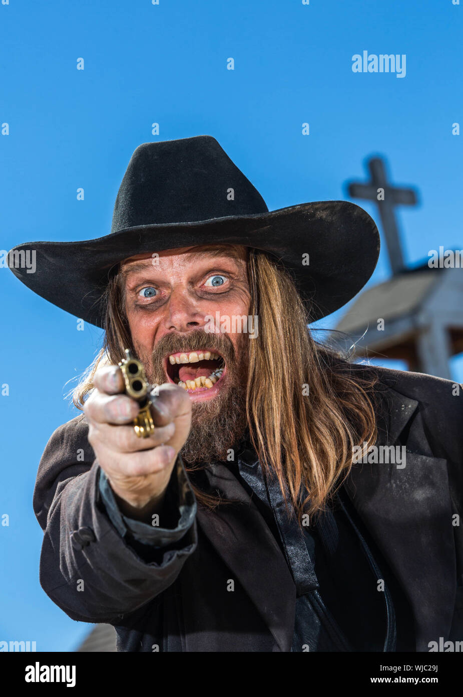 A Screaming Man Points Gun at Camera Stock Photo - Alamy