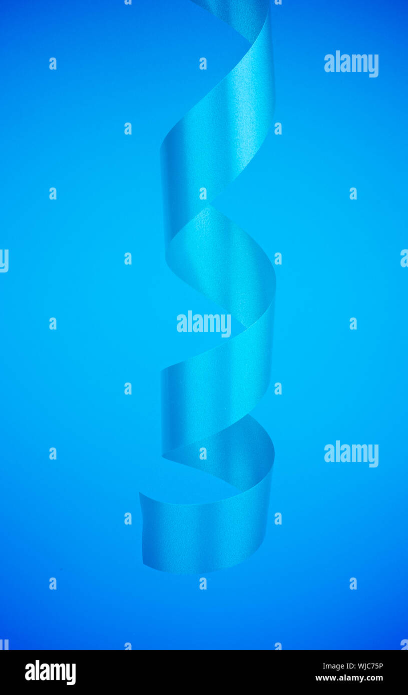 Blue Hanging Down Curly Party Streamer isolated on Blue background ...