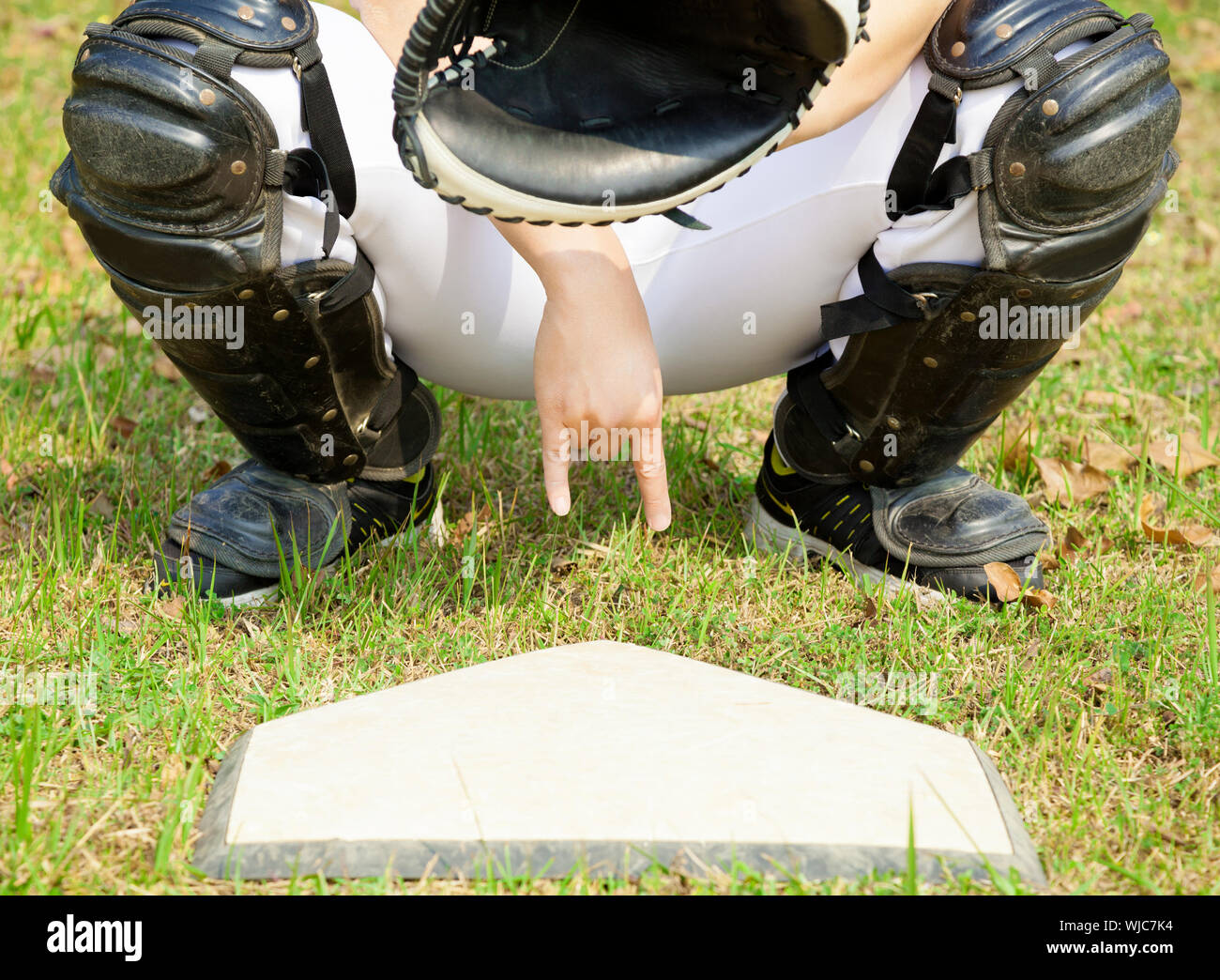 baseball catcher showing gesture for secret sign Stock Photo - Alamy