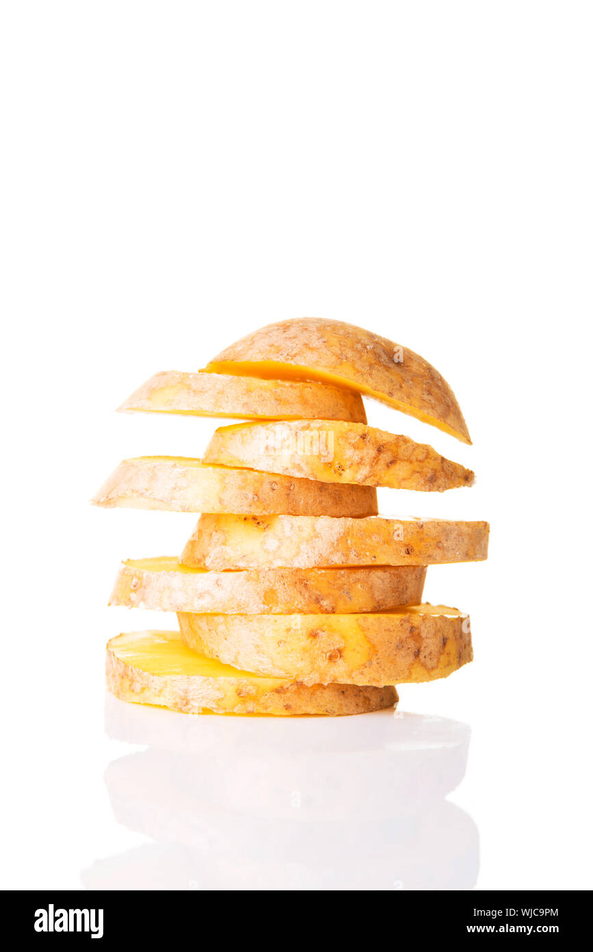 One sliced potatoe. Stack composition. Isolated on white Stock Photo ...