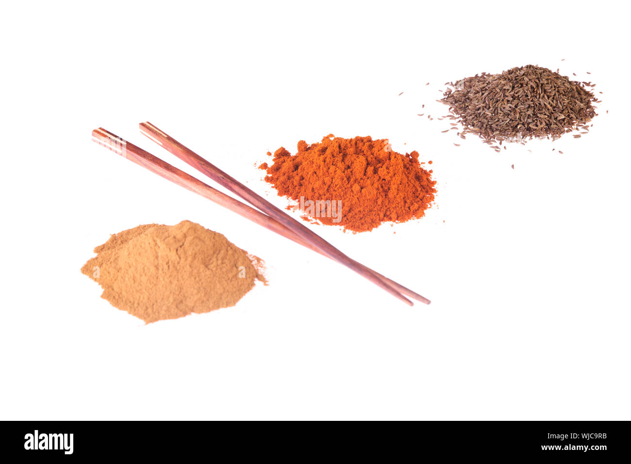 Curcuma or curry, pepper, chili pepper spices. Isolated on white Stock ...