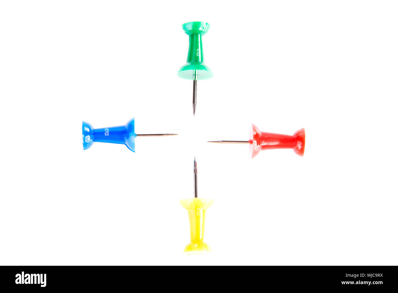 Four colorful drawing pins. Isolated on white Stock Photo - Alamy