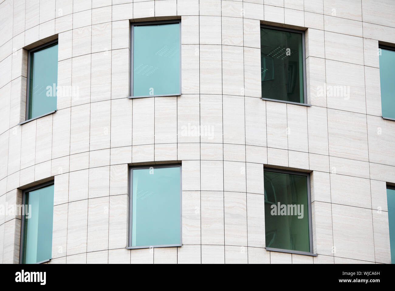 View on a building for offices, with greeny windows. Part of the ...