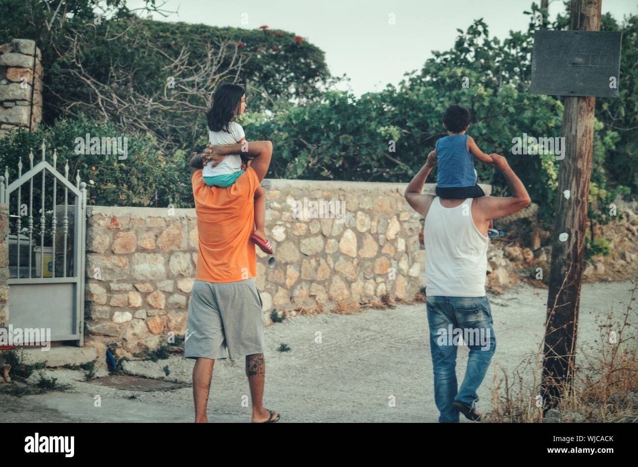 Carrying children hi-res stock photography and images - Alamy