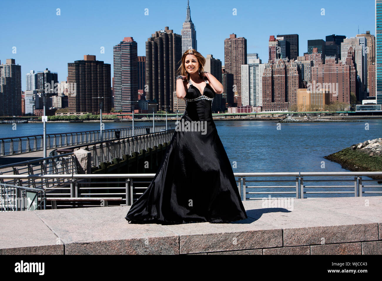 Beautiful happy Caucasian Latina fashion model woman in black evening ...