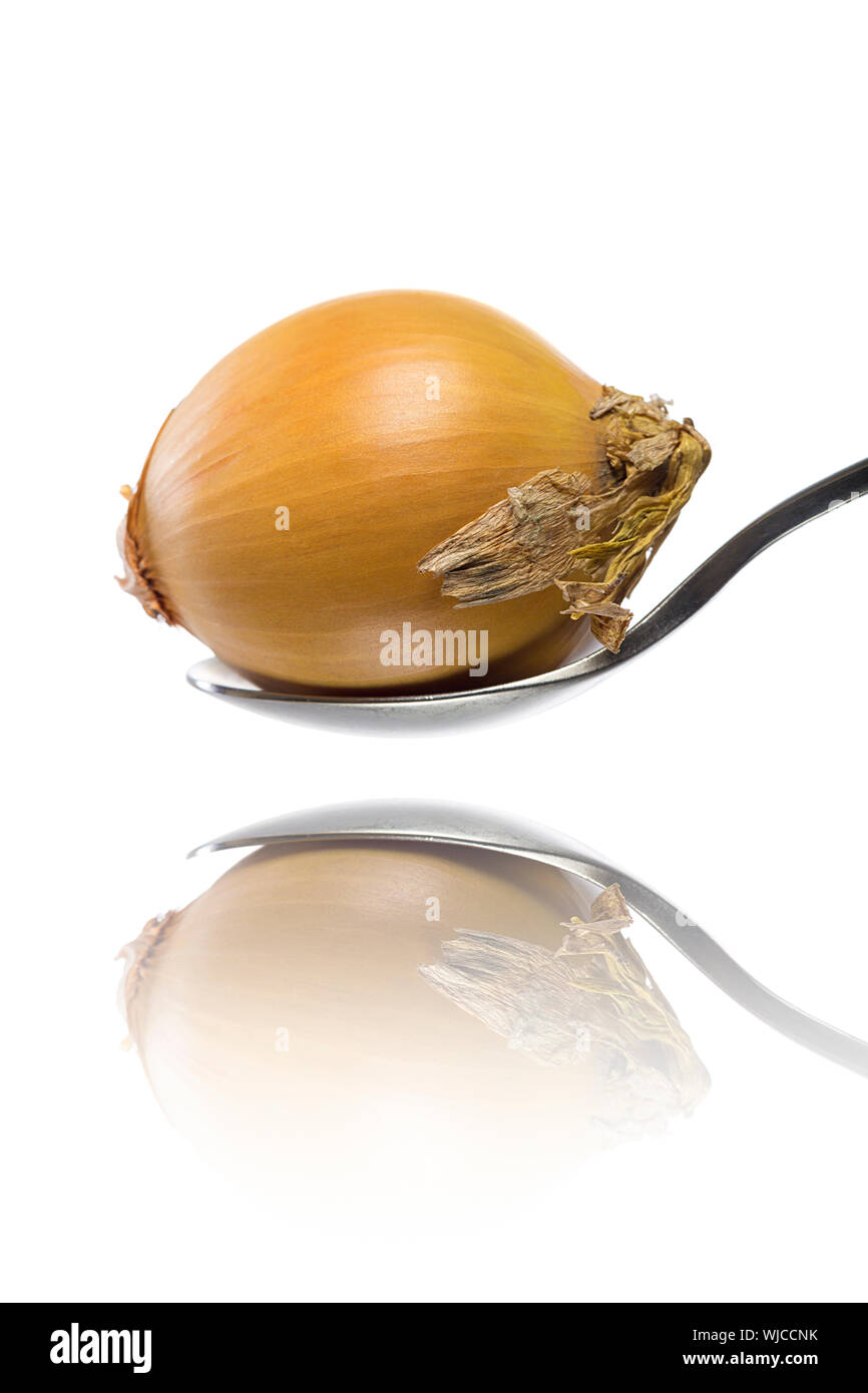 onion laying on a spoon, isolated on white Stock Photo - Alamy