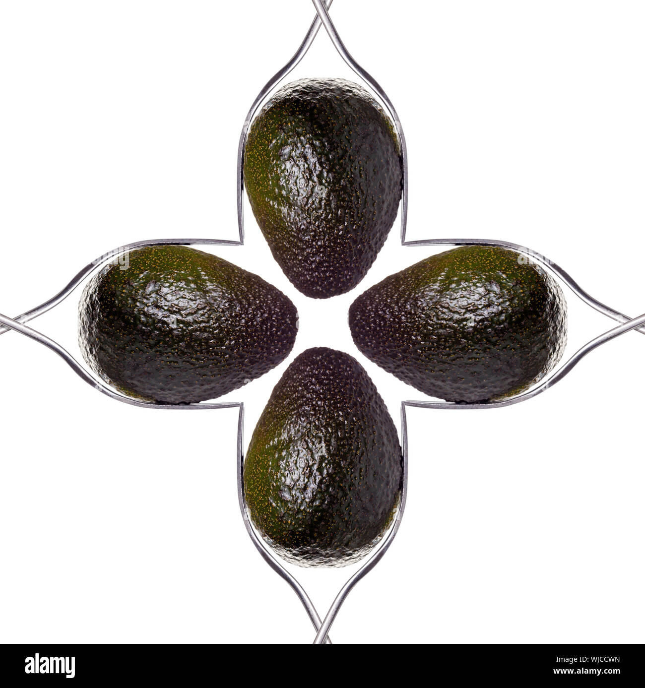 square of four avocados between two forks, isolated on white Stock ...
