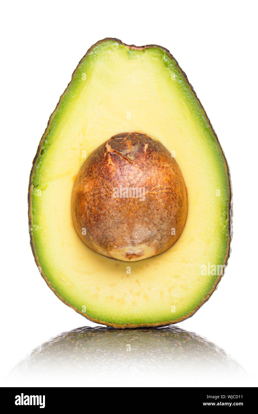 half of an avocado with kernel and reflection, isolated on white Stock ...
