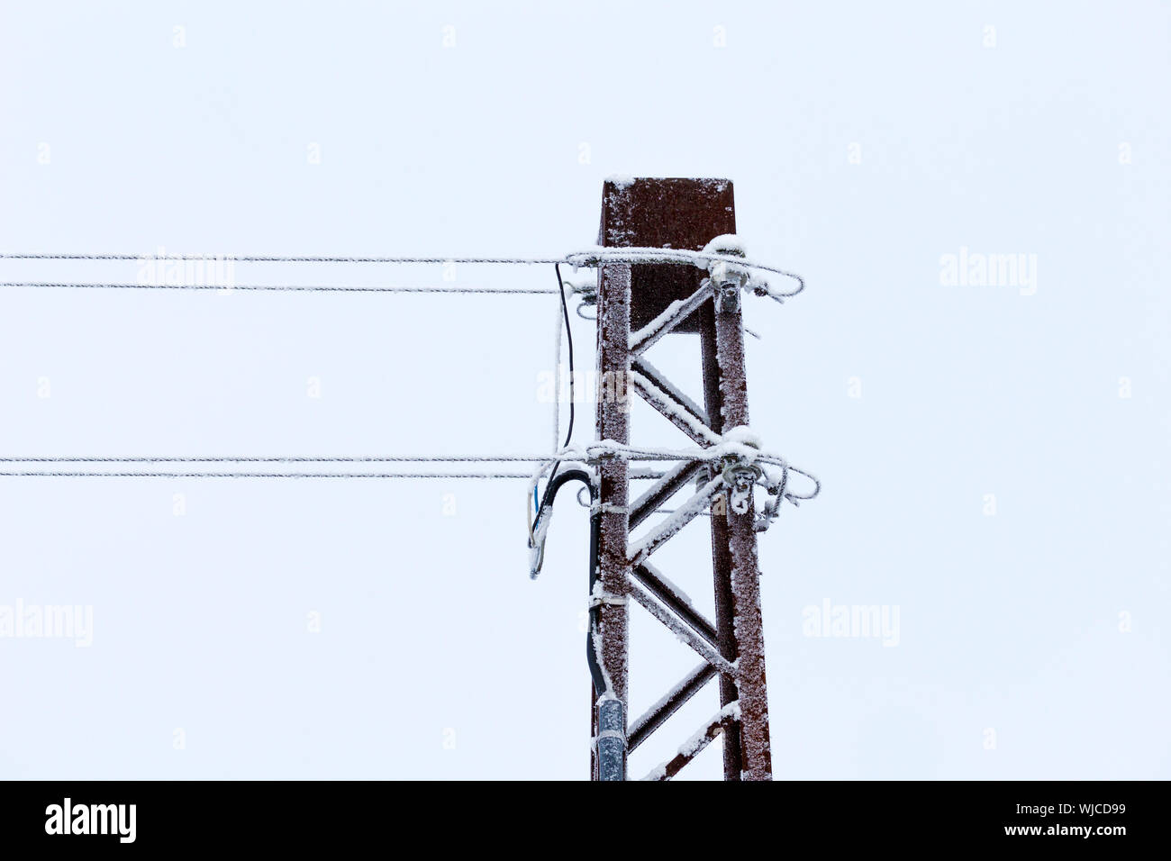 rusty old power-line isolated on with winter-sky Stock Photo - Alamy