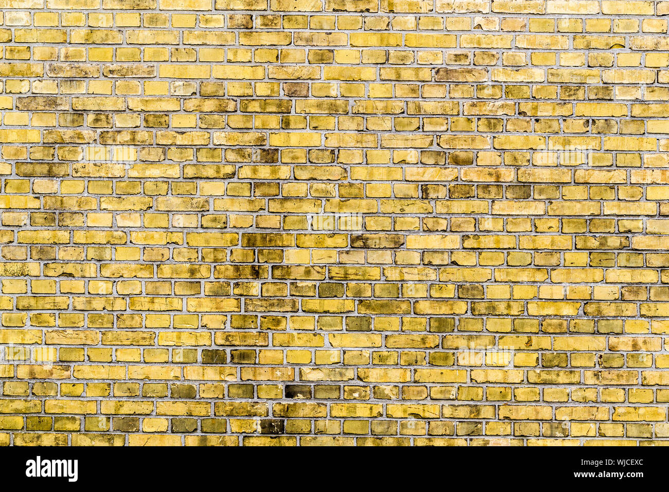 vintage yellow brick wall background Stock Photo - Alamy