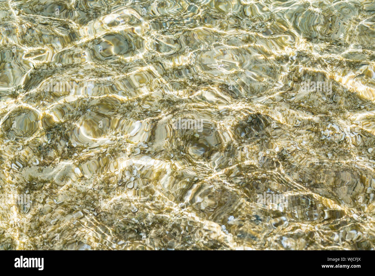 clear ocean water surface with reflections for backgrounds Stock Photo ...