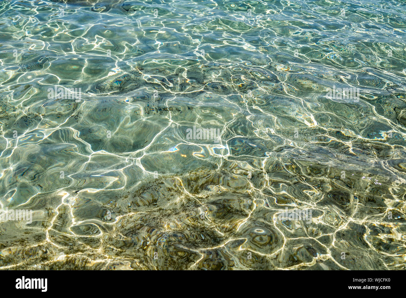 clear ocean water surface with reflections for backgrounds Stock Photo ...