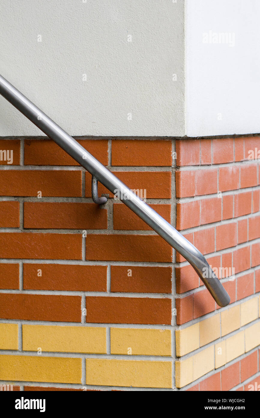 detail of an hand rail on a brick-wall Stock Photo - Alamy