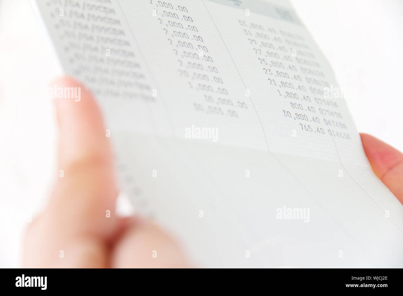 hand holding bank account book Stock Photo - Alamy