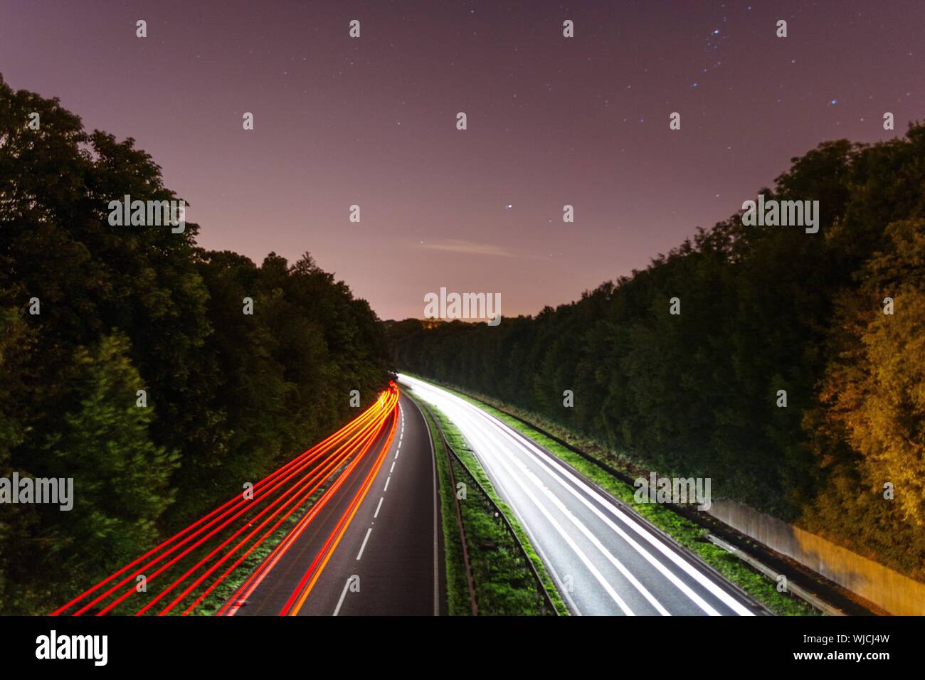 Winding road at night with light trails hi-res stock photography and ...