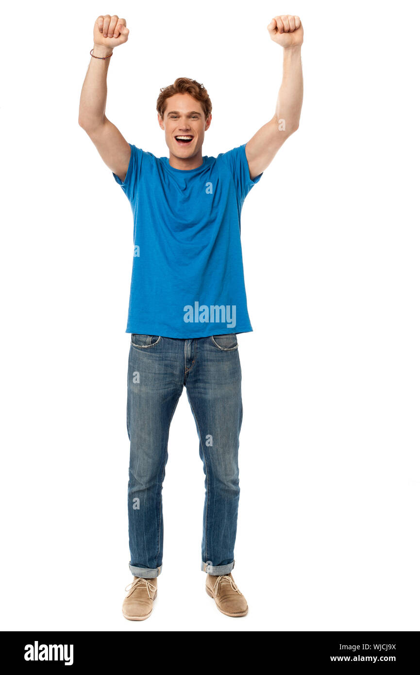 Young handsome victorious guy Stock Photo - Alamy