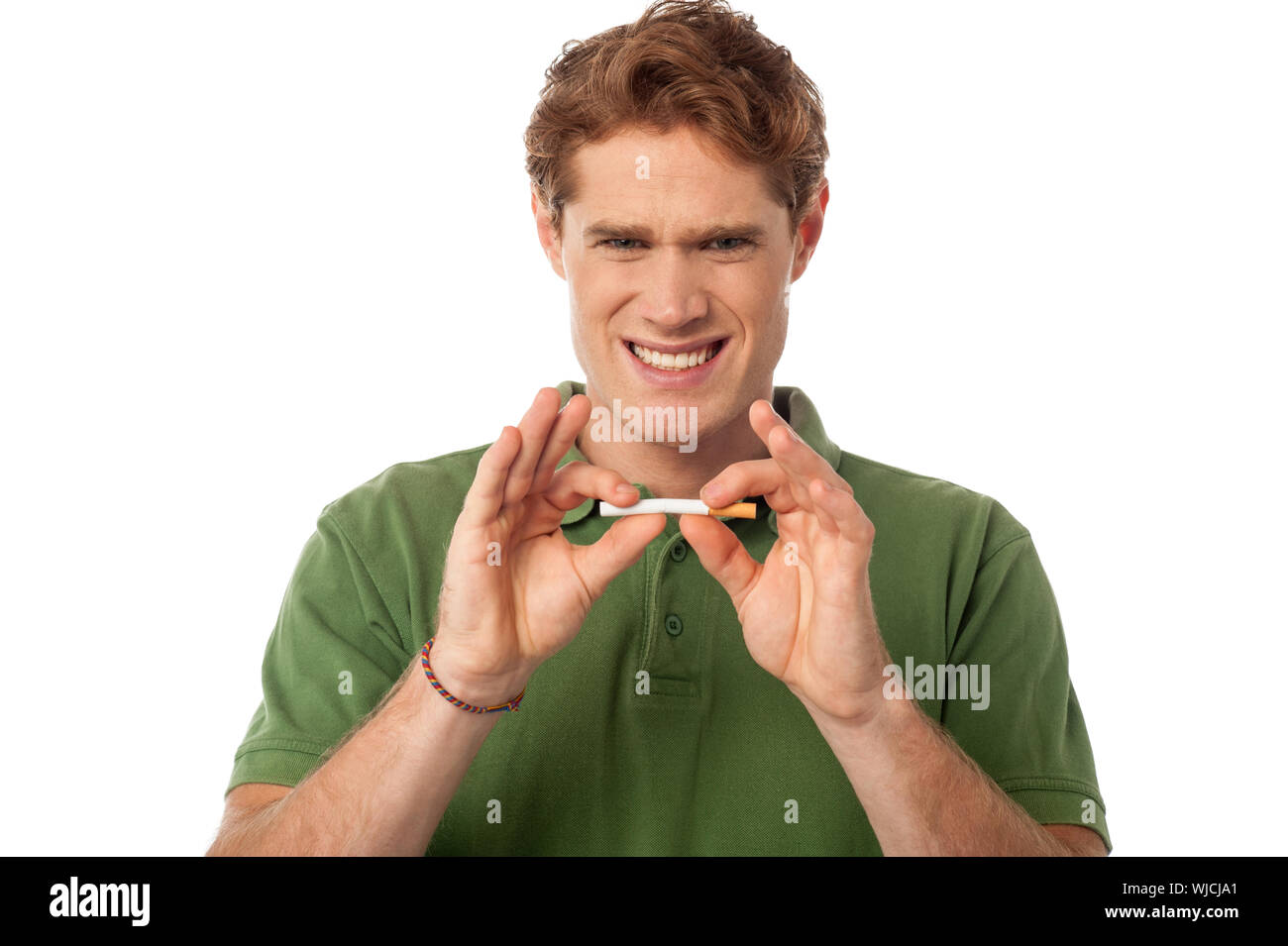 Young man breaking cigarette hi-res stock photography and images - Alamy