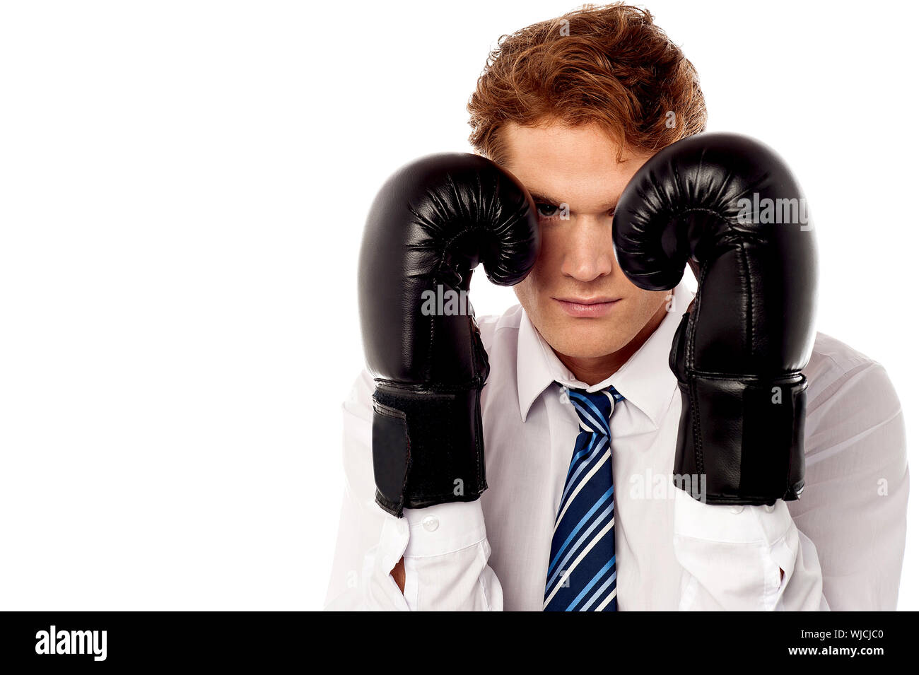 Angry businessman ready to punch you Stock Photo - Alamy