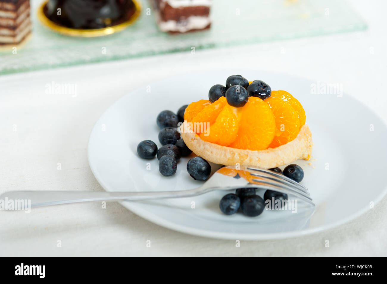 fresh blueberry and tangerine orange cream cupcake homemade closeup ...