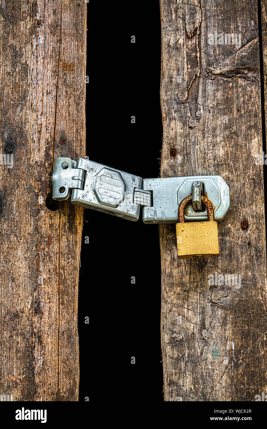 Old key lock on wooden door Stock Photo - Alamy