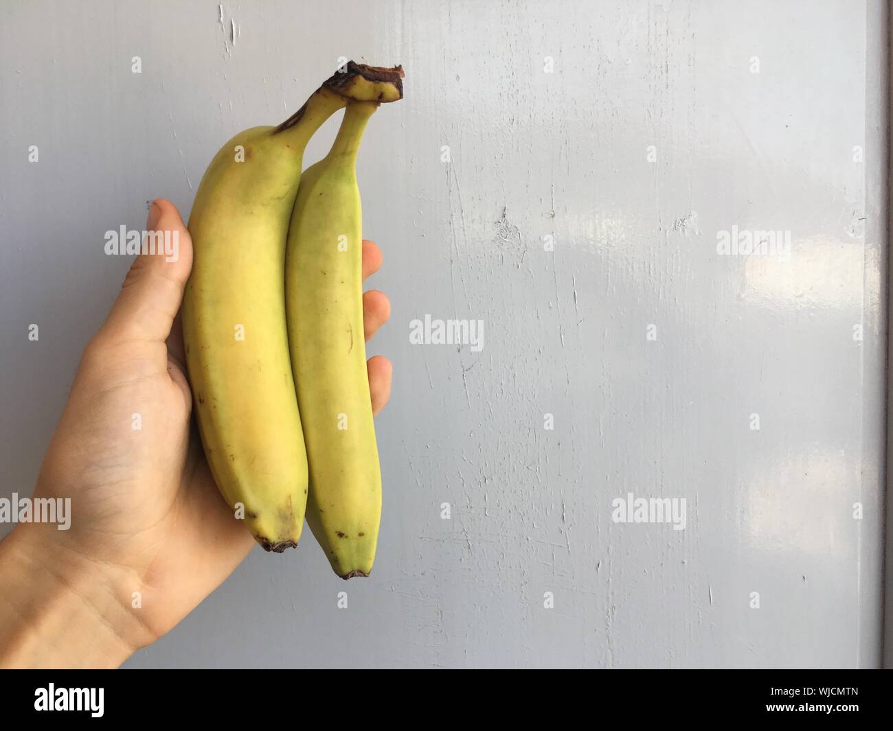 Hand bananas hi-res stock photography and images - Alamy