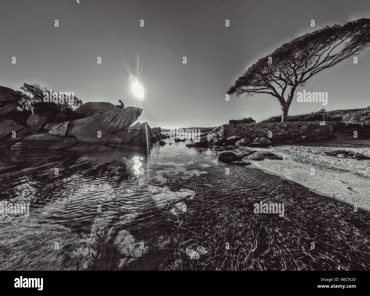 Sun shining through rock formation hi-res stock photography and images ...