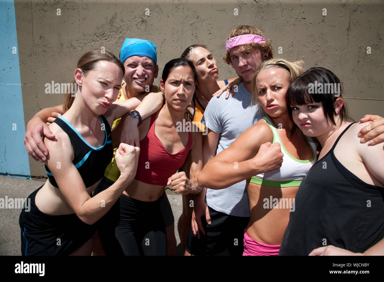 Group of runners pose after a race Stock Photo - Alamy