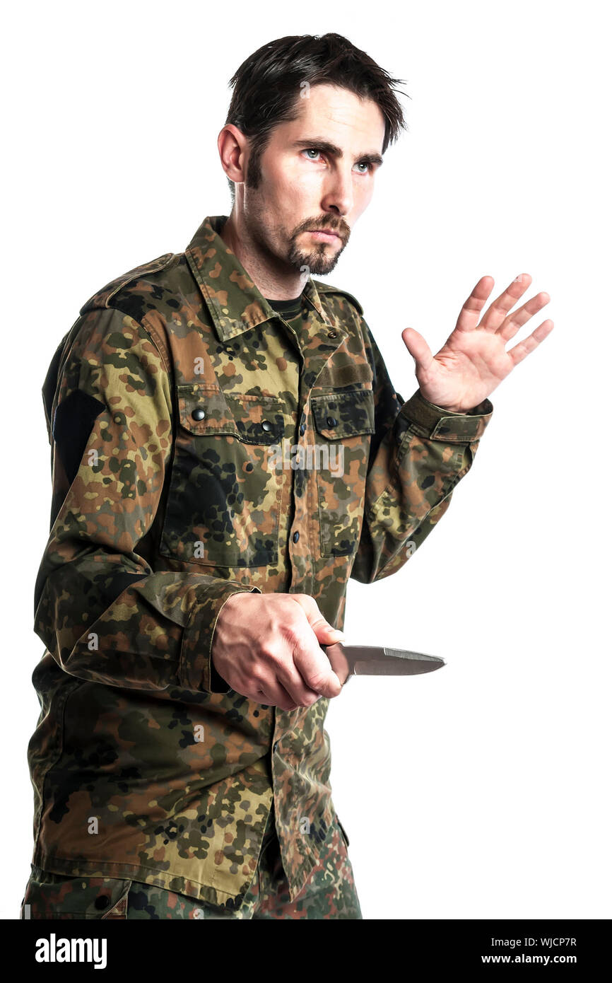 Male self defense instructor with camouflage do a self defense exercise ...