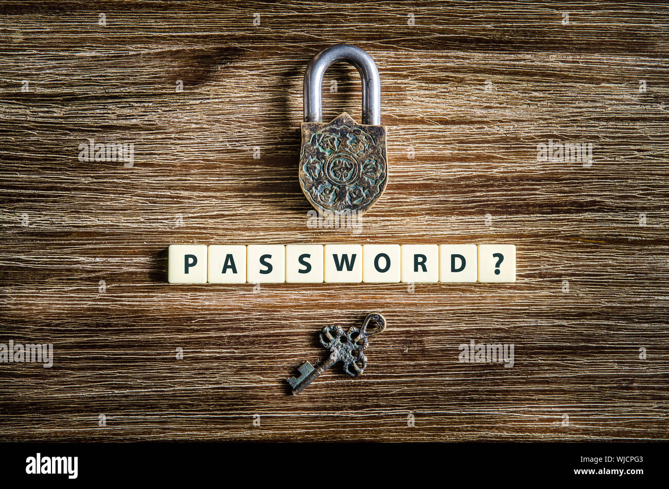 Old vintage padlock and key on wooden texture with password sign Stock ...