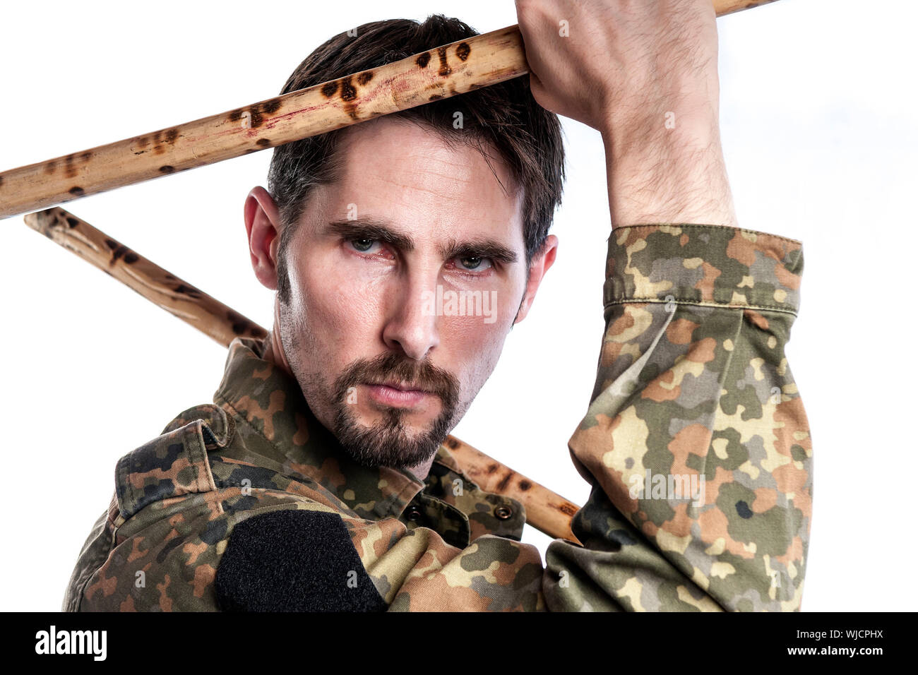 Male self defense instructor with camouflage do a self defense exercise ...