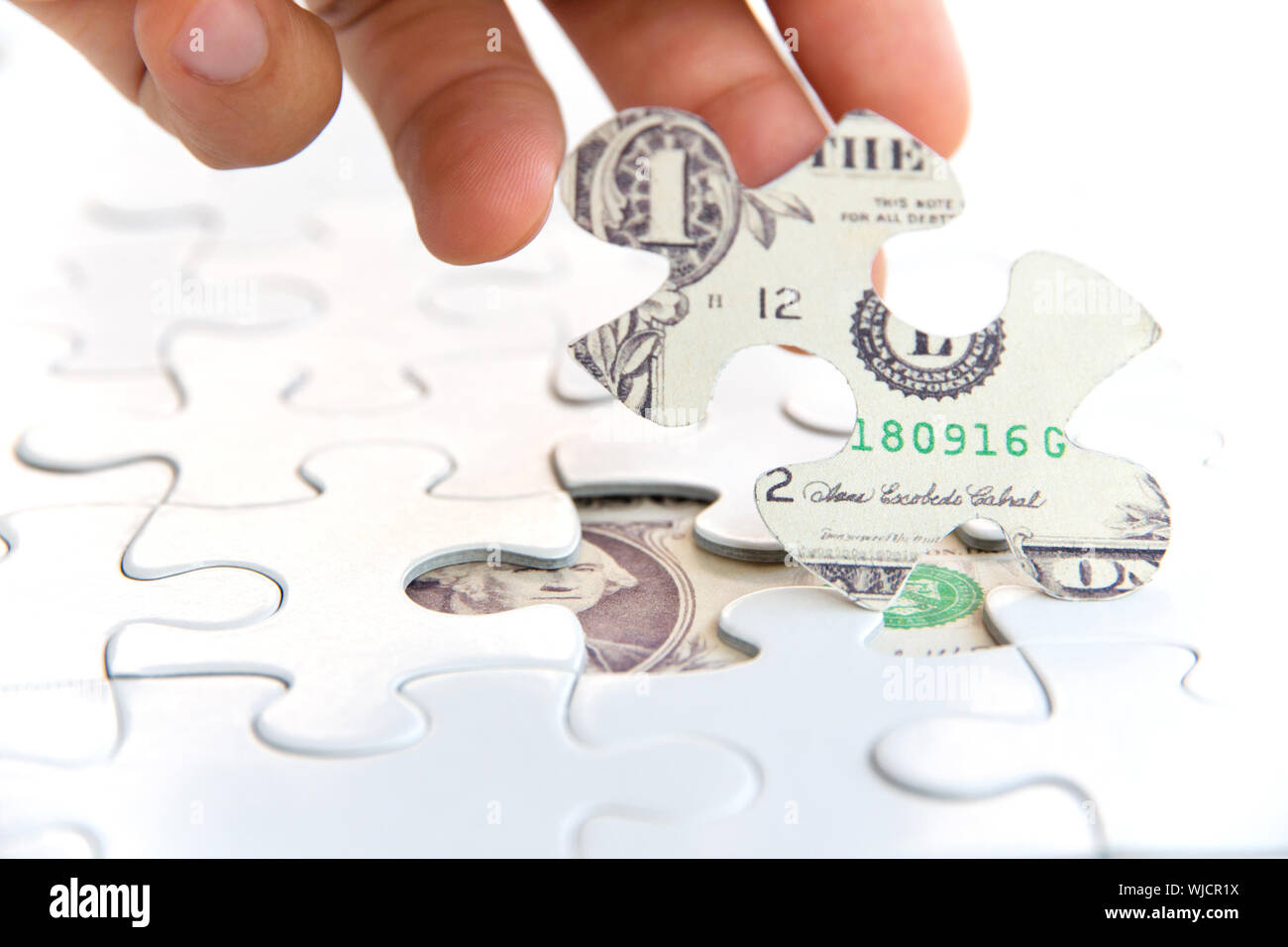 Hand holding puzzle piece icon hi-res stock photography and images - Alamy