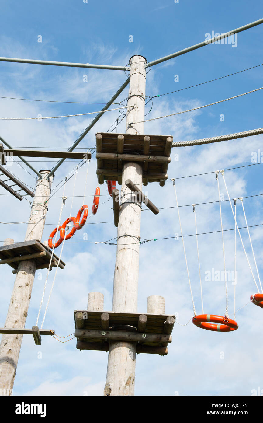 Climbing adventure with hanging ropes and bridges Stock Photo - Alamy