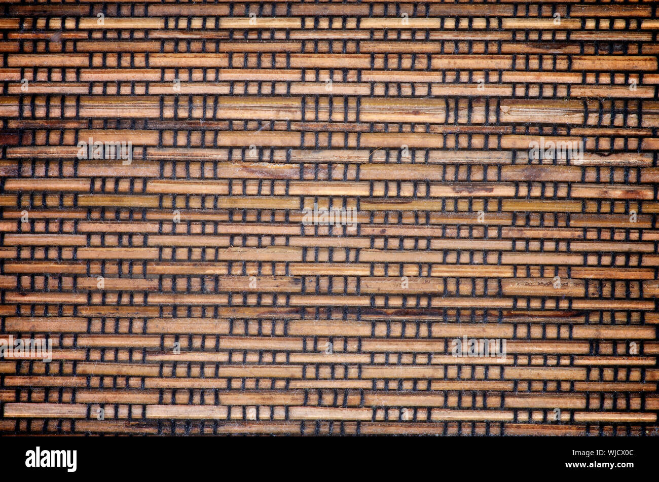 Brown and Beige Wicker Straw Mat Background closeup Stock Photo - Alamy