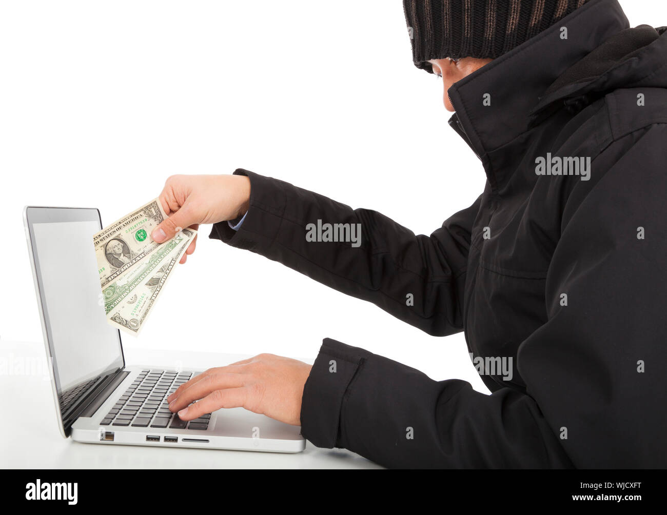 Hacker Steal money from the Internet with laptop Stock Photo - Alamy
