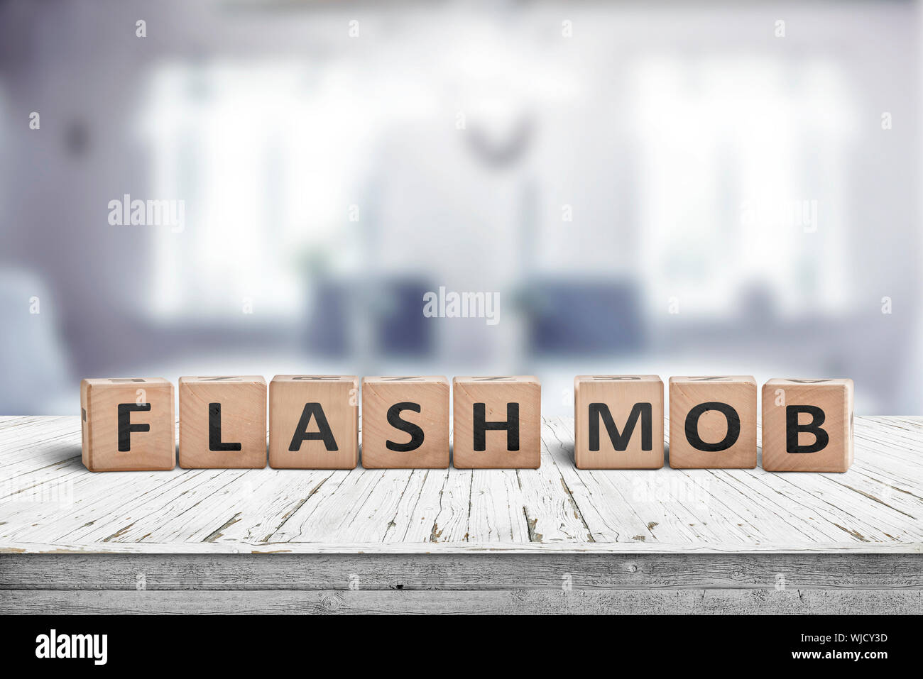 Flash mob message sign on a table in a bright room with light Stock ...