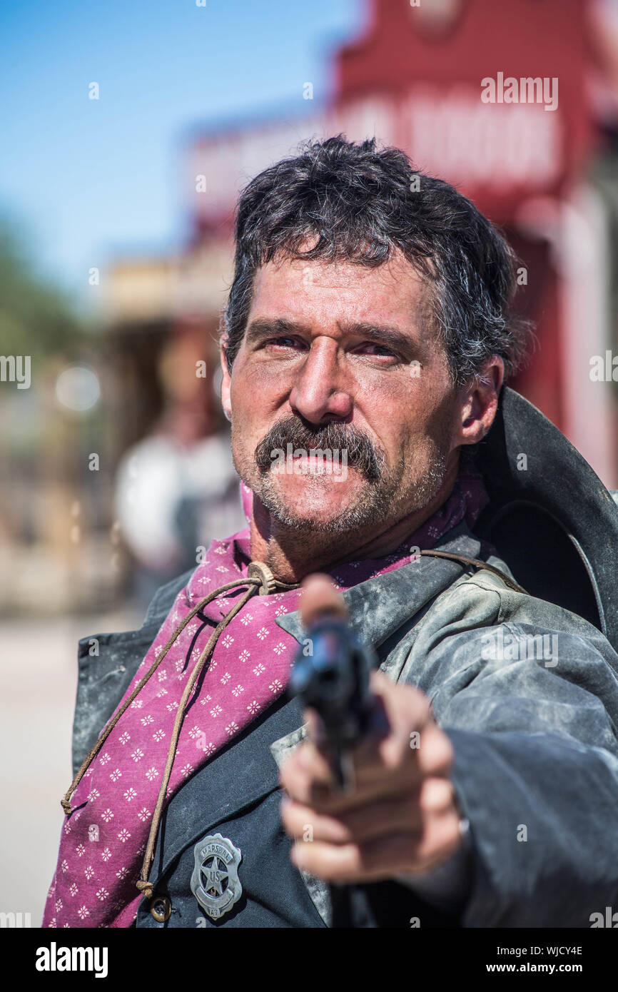 Serious Cowboy Points Gun at You Stock Photo - Alamy