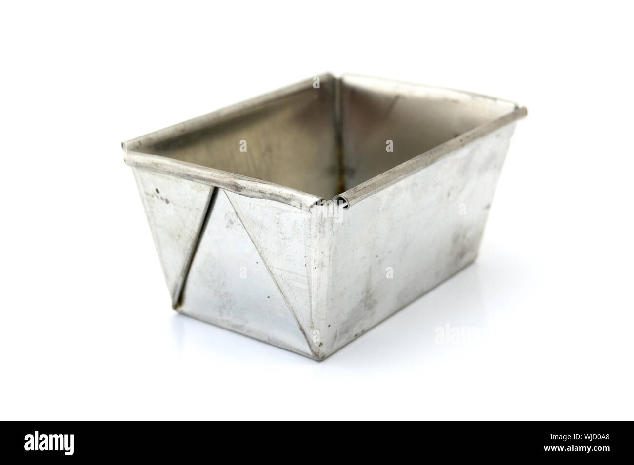 Little cake tin on a white background Stock Photo - Alamy