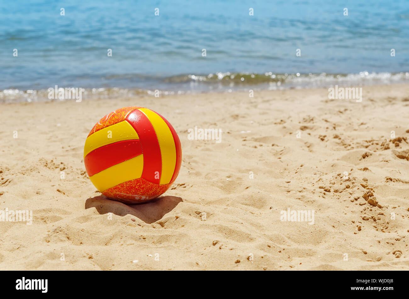 Colourful beach ball on sand hi-res stock photography and images - Alamy