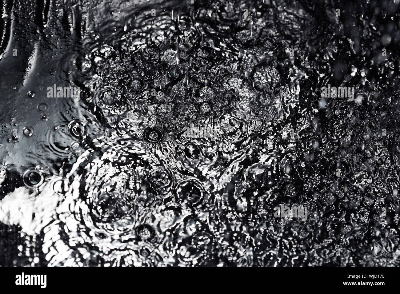 Top view on the ground with oil during rain Stock Photo - Alamy