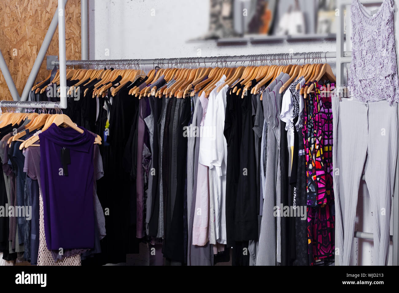 Luxury fashion clothes in display for sale in a retail shop Stock Photo ...