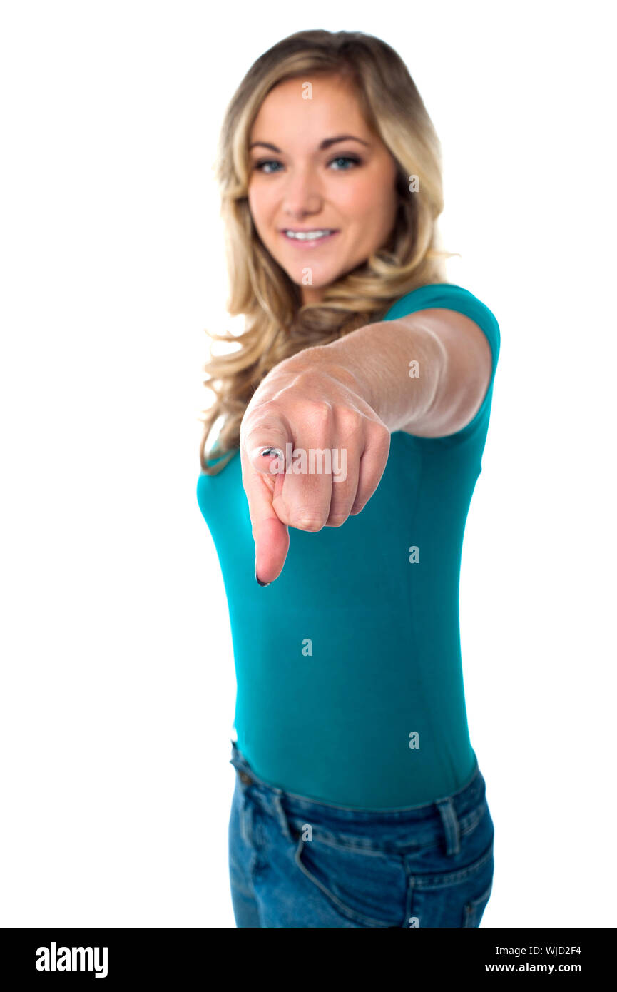 Attractive female pointing towards you Stock Photo - Alamy
