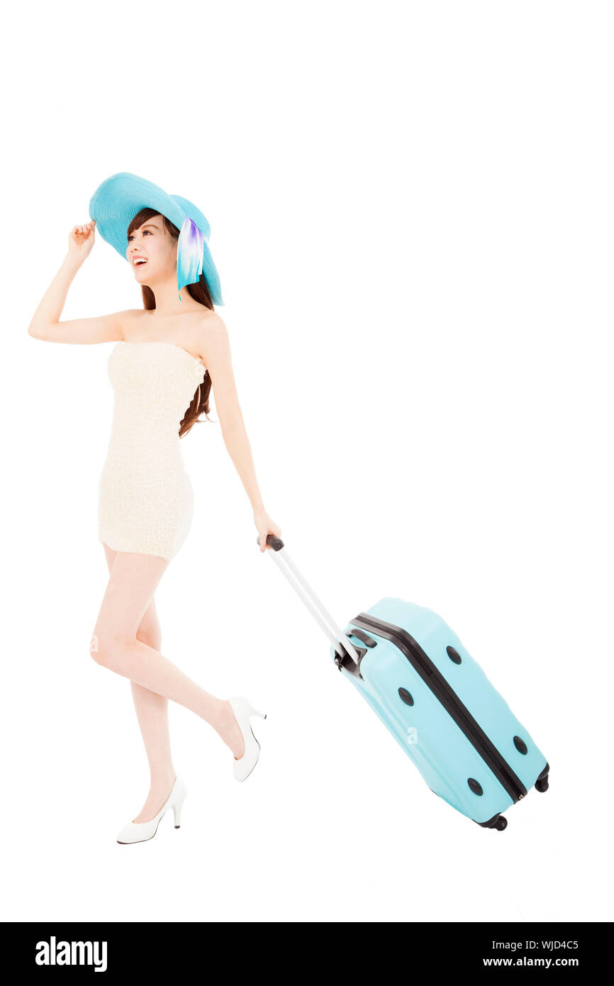 Fashionable woman running with suitcase Stock Photo - Alamy