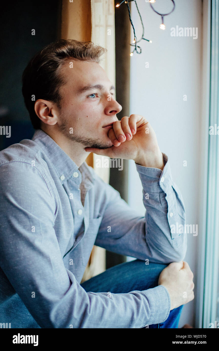 Businessman looking out of window view hi-res stock photography and ...