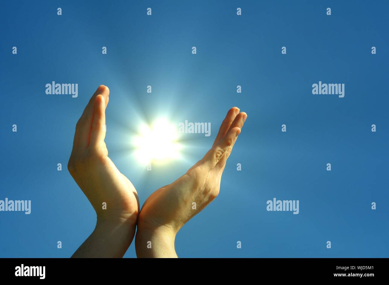 hand sun and blue sky showing hope peace or freedom concept Stock Photo ...
