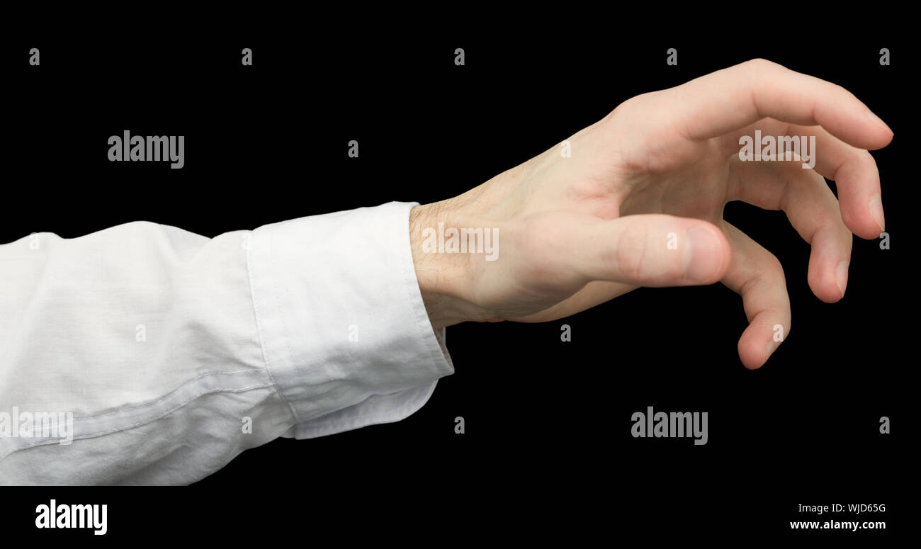 Greedy hand with crooked fingers on a black background Stock Photo - Alamy