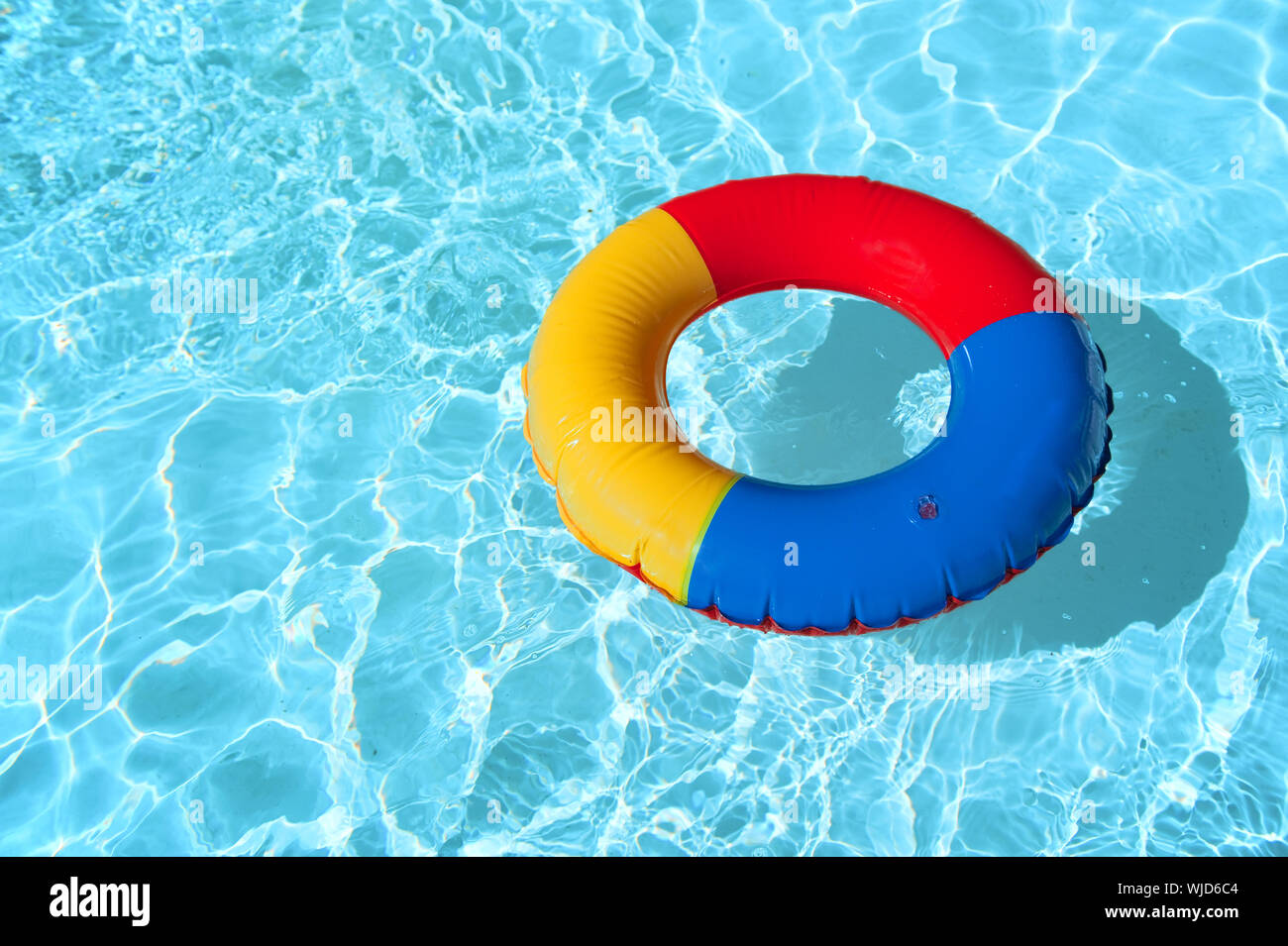 swimming pool with floatable toys in the water Stock Photo - Alamy